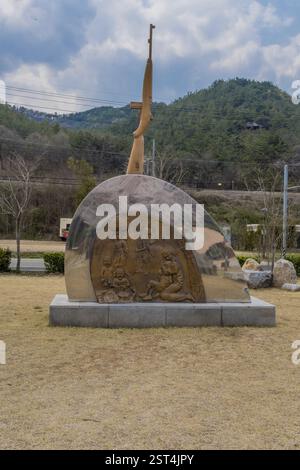 Hwanggan, South Korea, April 10, 2020: Two wooden waterwheels in front ...