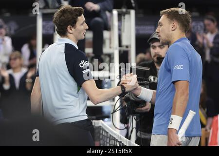 Hamad Medjedovic of Serbia (R) shakes hands with Daniil Medvedev of Russia after his semifinal ...