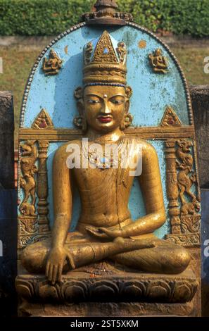 Huge gilded Buddha his hands touching earth inside Mahabodhi temple ...