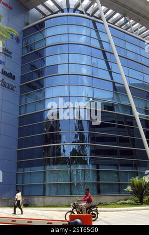 Reflection of a building on RMZ Corp, RMZ Titanium building a modern ...