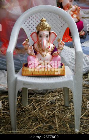 Idol Lord Ganesh sitting on mouse , elephant headed Hindu God Ganpati ...