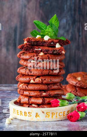 Red velvet cookies with white chocolate chips with milk Stock Photo - Alamy
