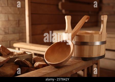 Bucket, ladle and hot rocks in sauna Stock Photo - Alamy