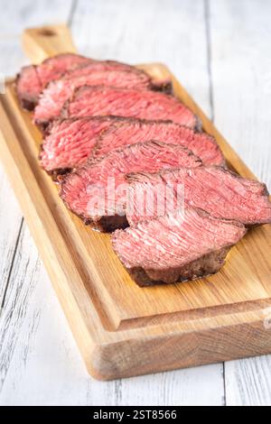 Tender fillet mignon steak, perfectly cooked, sliced, and elegantly ...