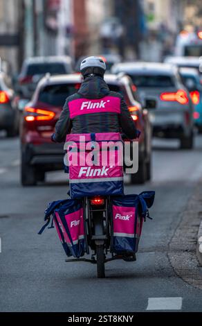 Express delivery service worker in medical mask with big food bag and ...