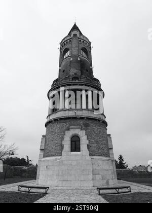 A low-angle shot of an old brick wall next to a beautiful field Stock ...