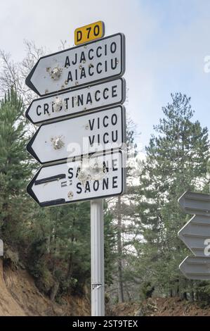 Road sign riddled with bullets in Corsica, France Stock Photo - Alamy