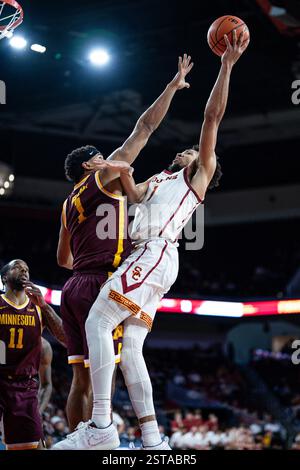 Minnesota guard Isaac Asuma (1) shoots over Purdue center Daniel ...