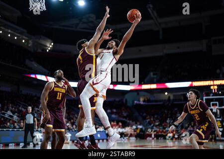 Minnesota guard Isaac Asuma (1) shoots over Purdue center Daniel ...