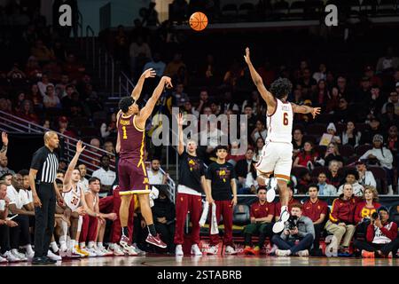 Minnesota guard Isaac Asuma (1) shoots over Purdue center Daniel ...
