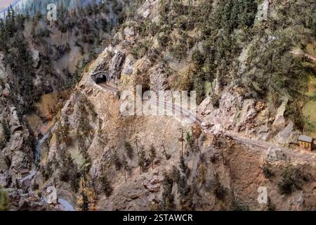 Model railway with tunnel. A miniature scale model railway with a ...