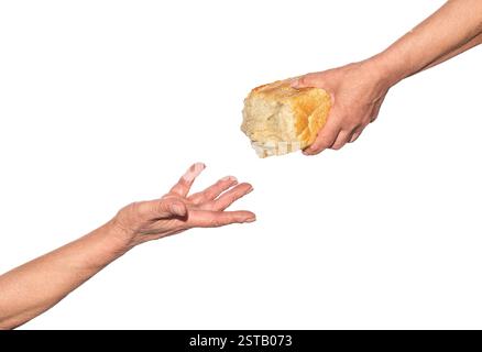 Elder woman hand give a loaf of bread to hands of a beggar. Poverty and ...