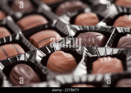 a variety of chocolates on a light background Stock Photo - Alamy