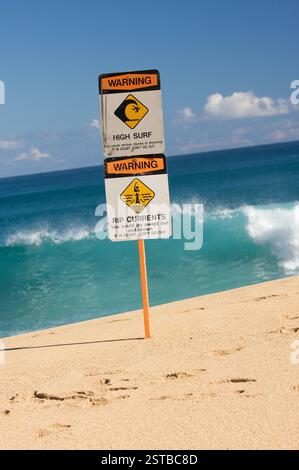 Surf and Currents Warning Sign on a beach in Hawaii Stock Photo - Alamy