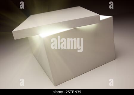 White Box with Lid Revealing Something Very Bright Stock Photo - Alamy