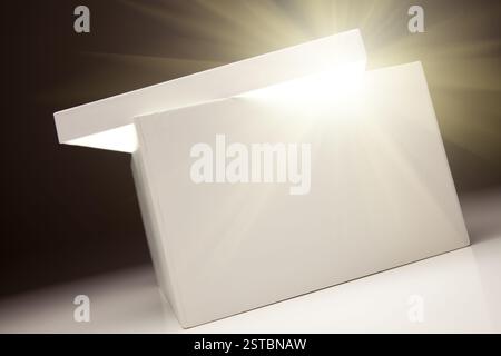 White Box with Lid Revealing Something Very Bright Stock Photo - Alamy