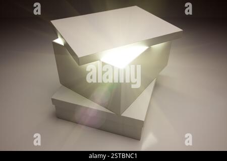 White Box with Lid Revealing Something Very Bright Stock Photo - Alamy