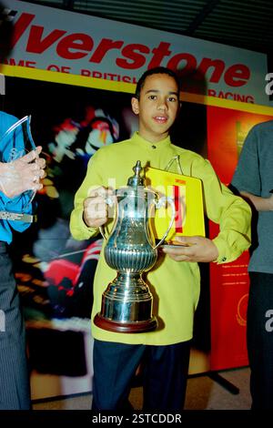 Lewis Hamilton seen here in early 1998 picking up his trophy for his ...