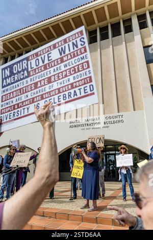 March 1, 2025, Santa Barbara, Ca, USA: A woman in Tupac Shirt holds a ...