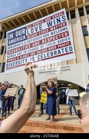 March 1, 2025, Santa Barbara, Ca, USA: A woman in Tupac Shirt holds a ...
