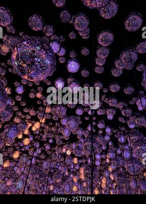 TeamLab Borderless art installation purple light bulbs room warm colors ...
