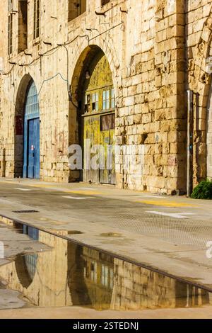 The weathered stone wall of the historic city of Trujillo Spain ...