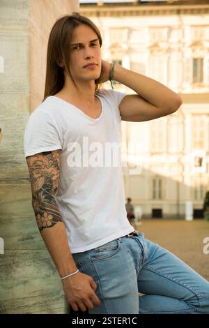 Handsome young man meditating on light background Stock Photo - Alamy