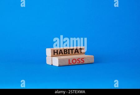 Habitat loss symbol. Wooden blocks with words Habitat loss. Beautiful ...