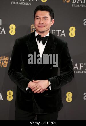 Henry Golding attends The Fashion Awards 2025 at the Royal Albert Hall ...