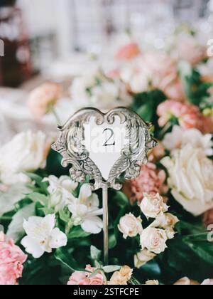 Table setting with beautiful alstroemeria flowers on blue background ...