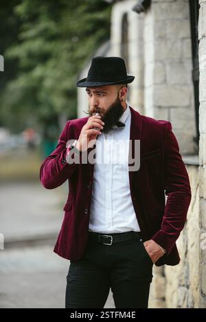 Rich man with a beard, thinking about business Stock Photo - Alamy