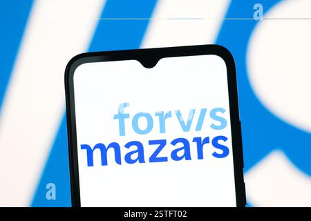 In this photo illustration, the Forvis Mazars logo is seen displayed on ...