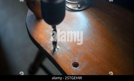 Old carpenter repairing chair at home Stock Photo - Alamy
