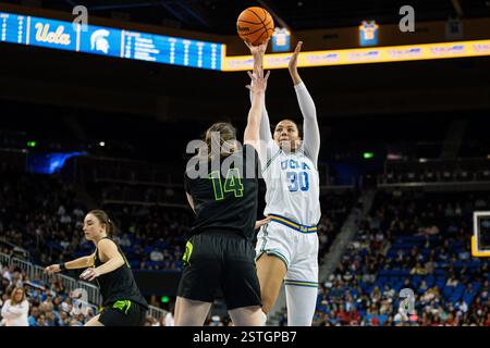 UCLA forward Timea Gardiner (30) and Illinois forward Brynn Shoup-Hill ...