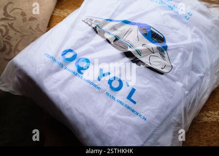 A plastic package containing sheets, towel, blanket for use in a train ...