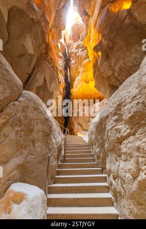 Sunlight illuminating Jabal Al Qarah mountain rock caves and walking ...