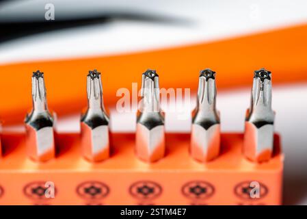 Detail of torx security magnetic precision screwdriver bits on white ...