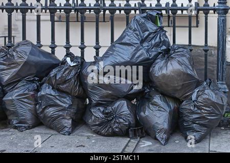 Big heap of trash bags with garbage on white background Stock Photo - Alamy