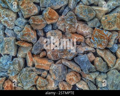 Grey rocks with different colour stones background Stock Photo - Alamy