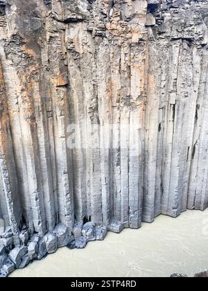 The image depicts a dramatic geological landscape characterized by ...