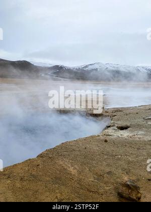 The image depicts a stunning natural landscape featuring a waterfall ...