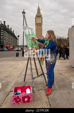 Artist Emily Powell paints on the beach on St Mary's island in the ...