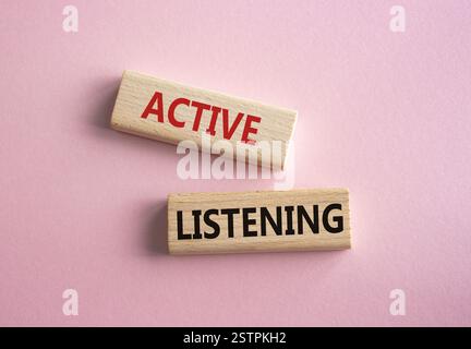 Active listening symbol. Wooden blocks with words Active listening ...