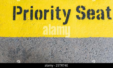 Priority Seat Yellow Sign Stock Photo - Alamy