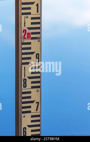 Depth stick for measuring the water level in a river Stock Photo - Alamy