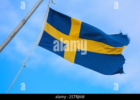 Swedish flag flying in blue with yellow cross isolated on white Stock ...