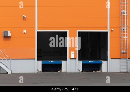 Two Cargo Doors at Orange Distribution Warehouse Stock Photo - Alamy