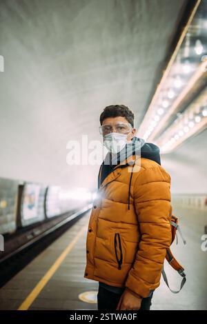 Guy standing at station in medical protective mask on his face Stock ...
