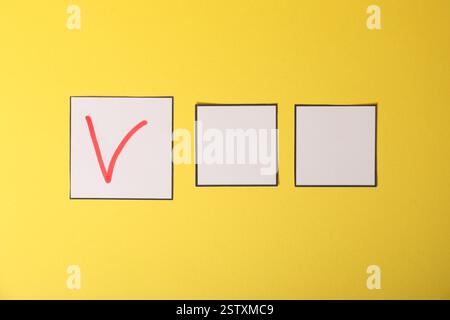 One checkbox with tick mark among others on light blue background, flat ...