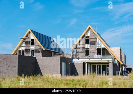 Modern Family Houses Under Construction in Dutch Suburb on a Sunny Day ...